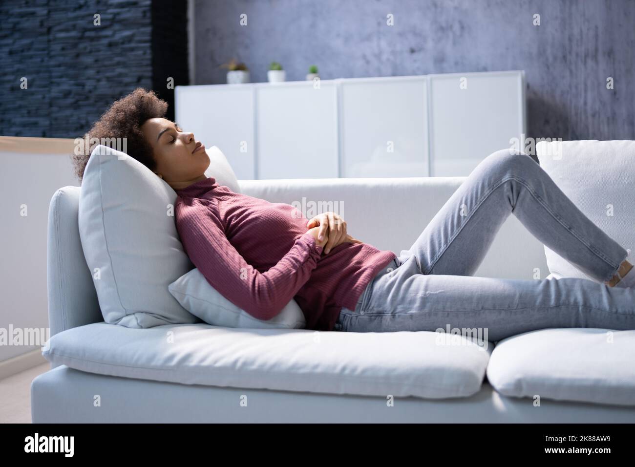 Lazy Woman Sleeping On Couch Or Sofa Stock Photo - Alamy