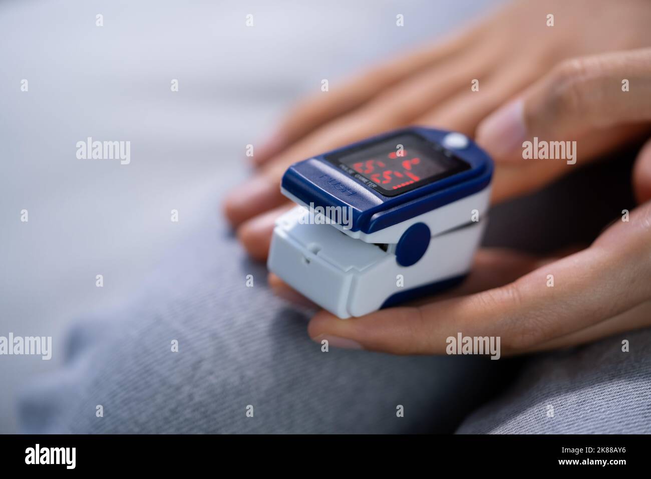 African Hand Pulse Heart Rate And Oximeter Stock Photo - Alamy