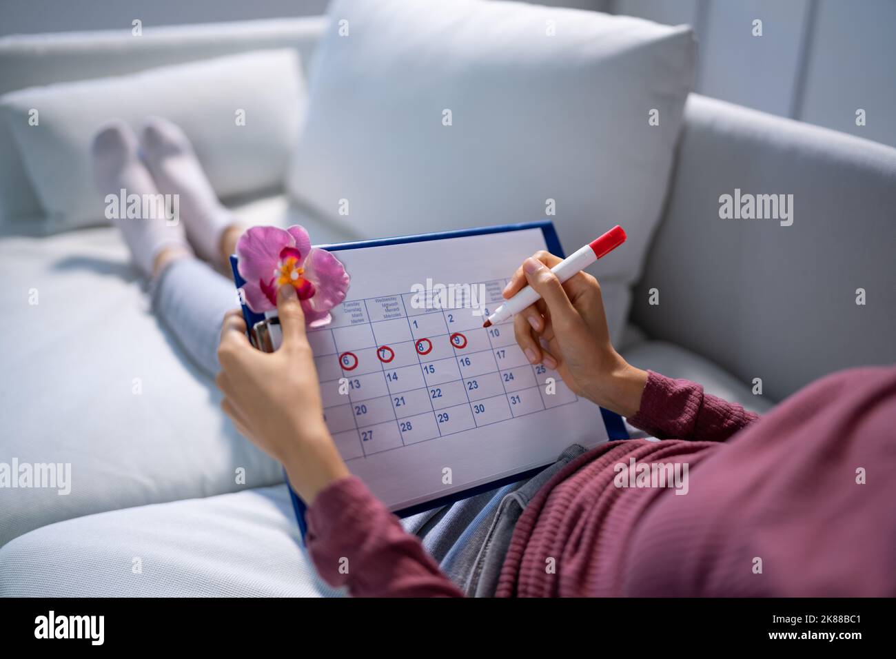 African Woman Using Menstrual Cycle Or Period Calendar Stock Photo - Alamy