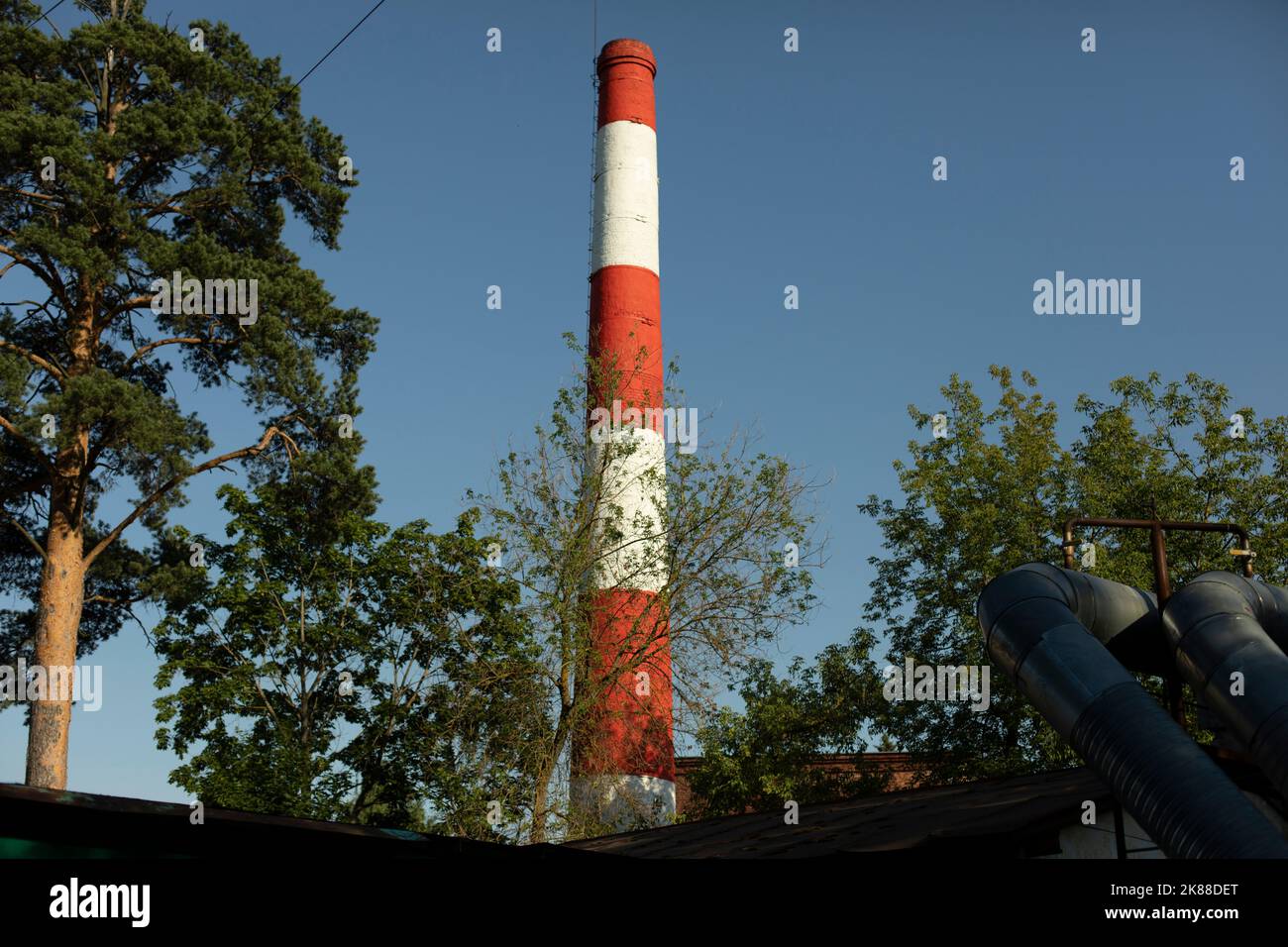 Red industrial pipe. Pipe factory. Details of industrial facility ...