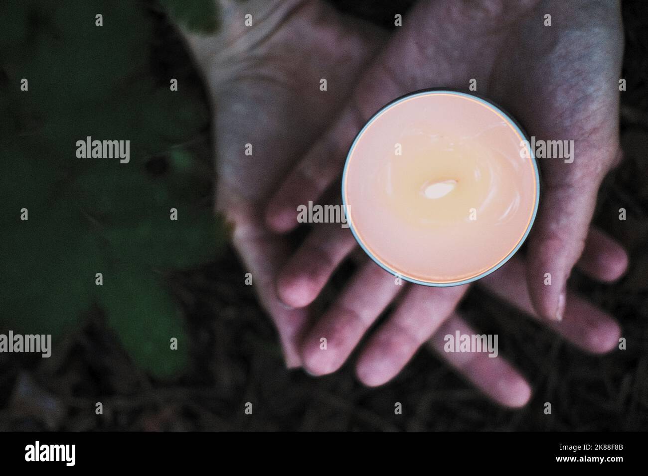 candle in hand, for meditation Stock Photo - Alamy