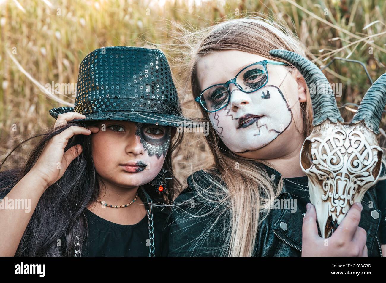 Teenage girls in hard rock costumes celebrate Halloween party Stock ...