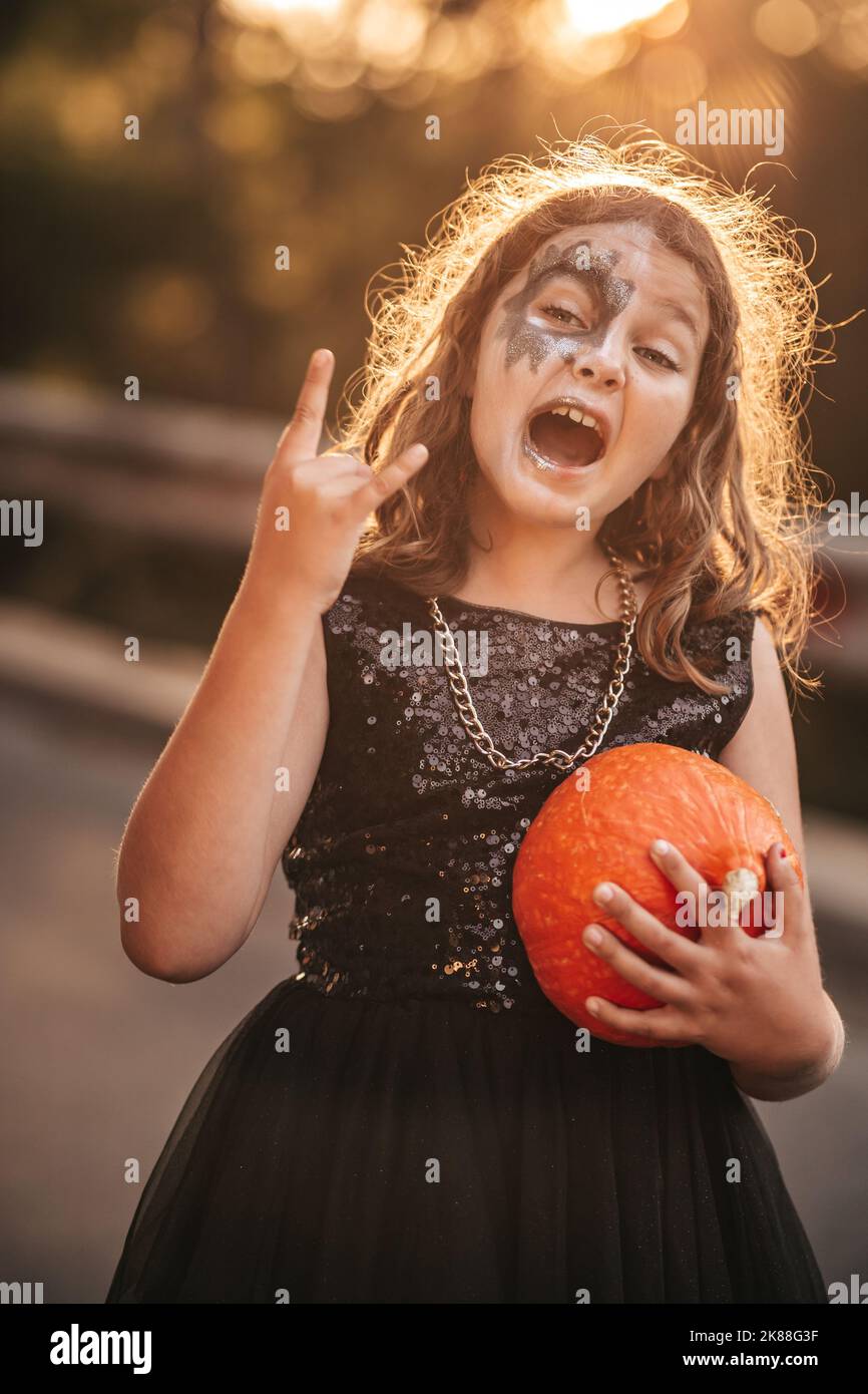 Teenage girl in hard rock costumes celebrate Halloween party Stock ...