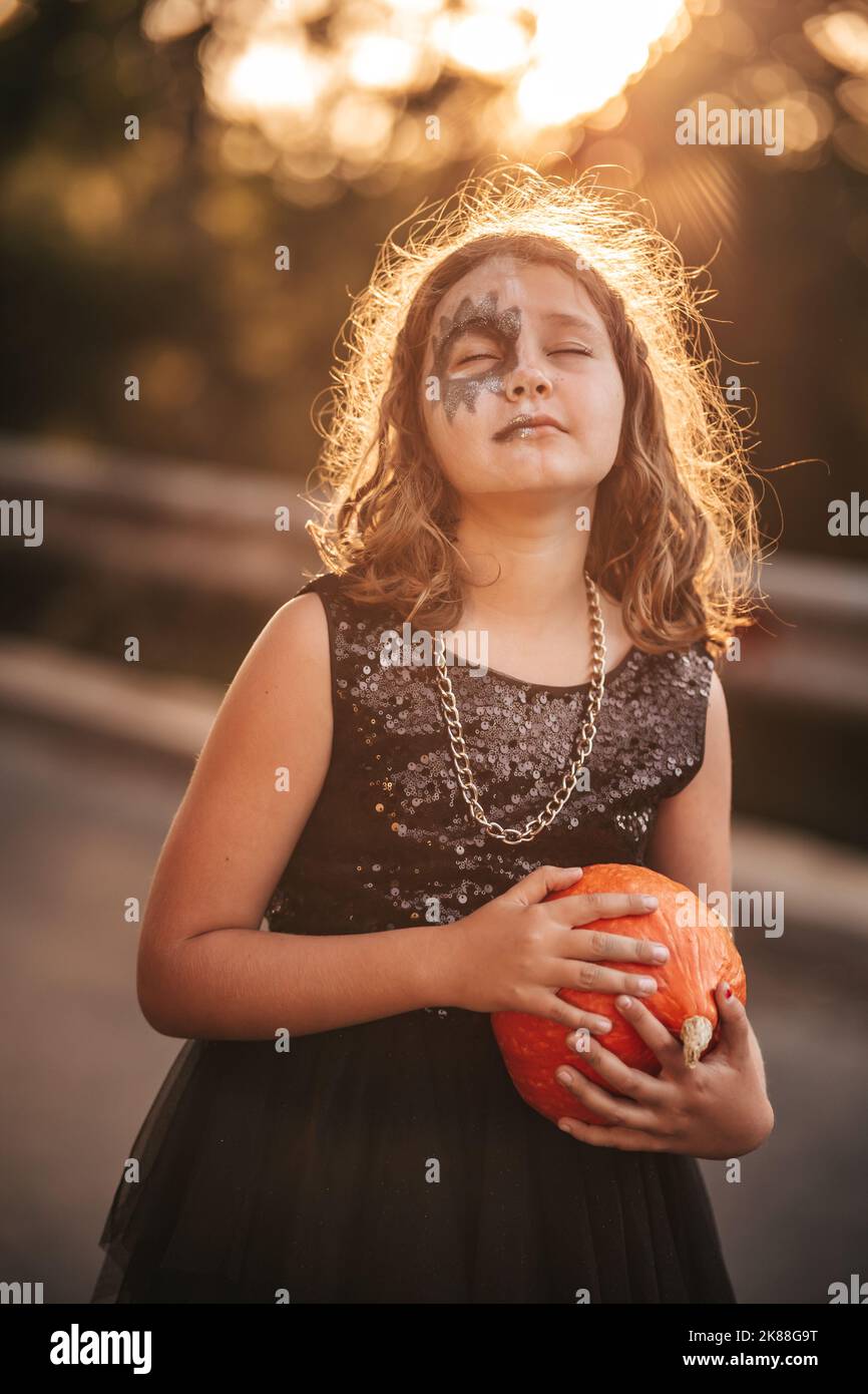 Teenage girls in hard rock costumes celebrate Halloween party Stock ...