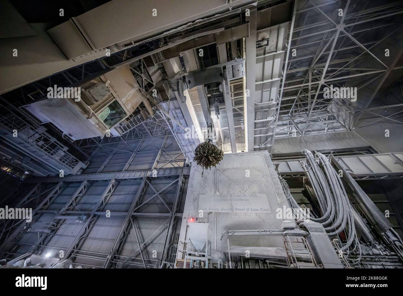 Magnet lifting metal at steel mill Stock Photo - Alamy