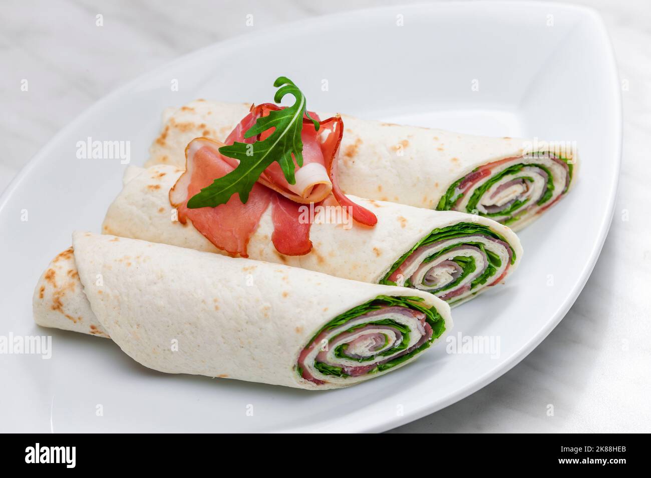 wraps filled with letuce and schwarzwald ham Stock Photo - Alamy