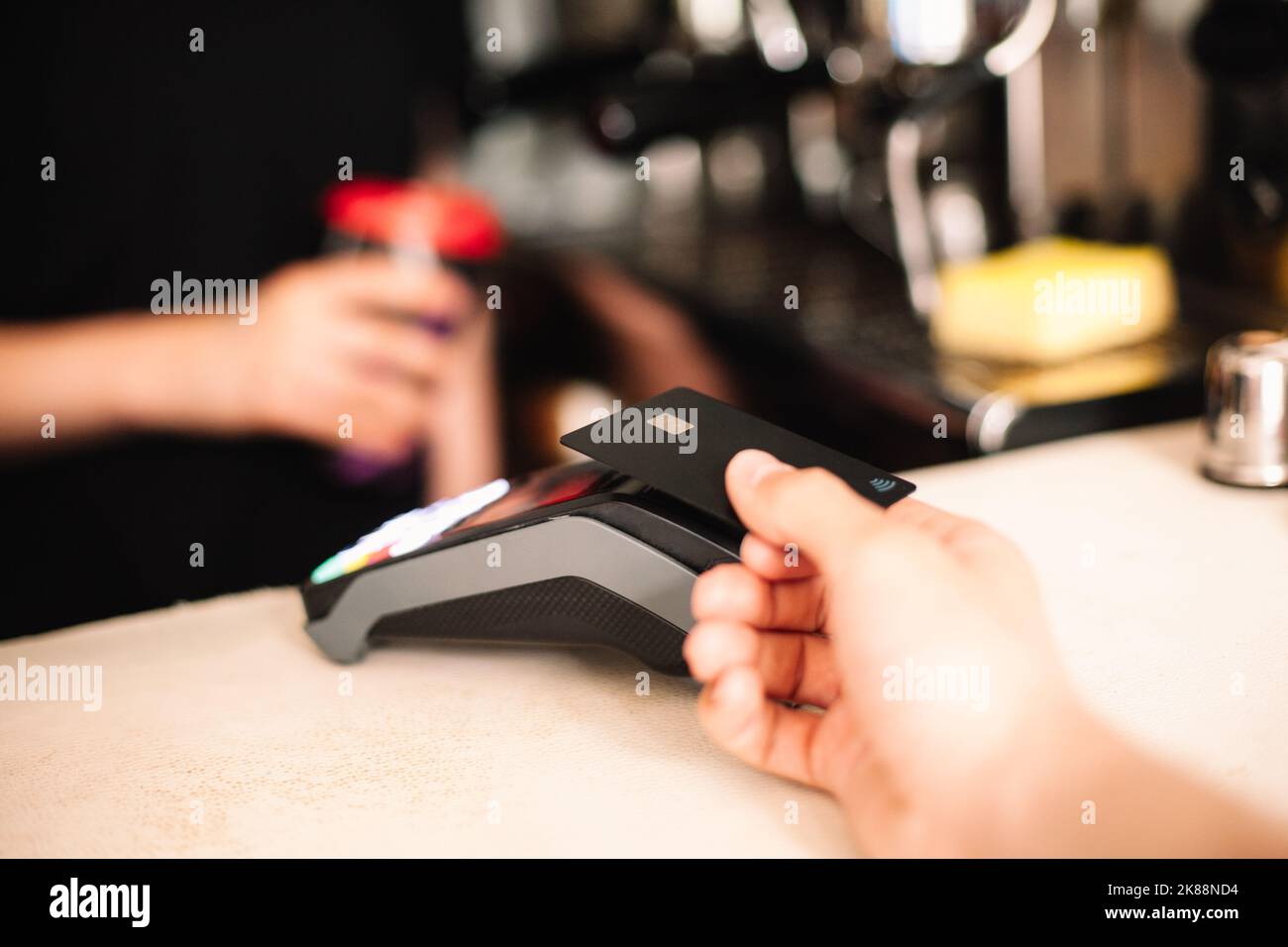 Customer making contactless payment using credit card Stock Photo - Alamy