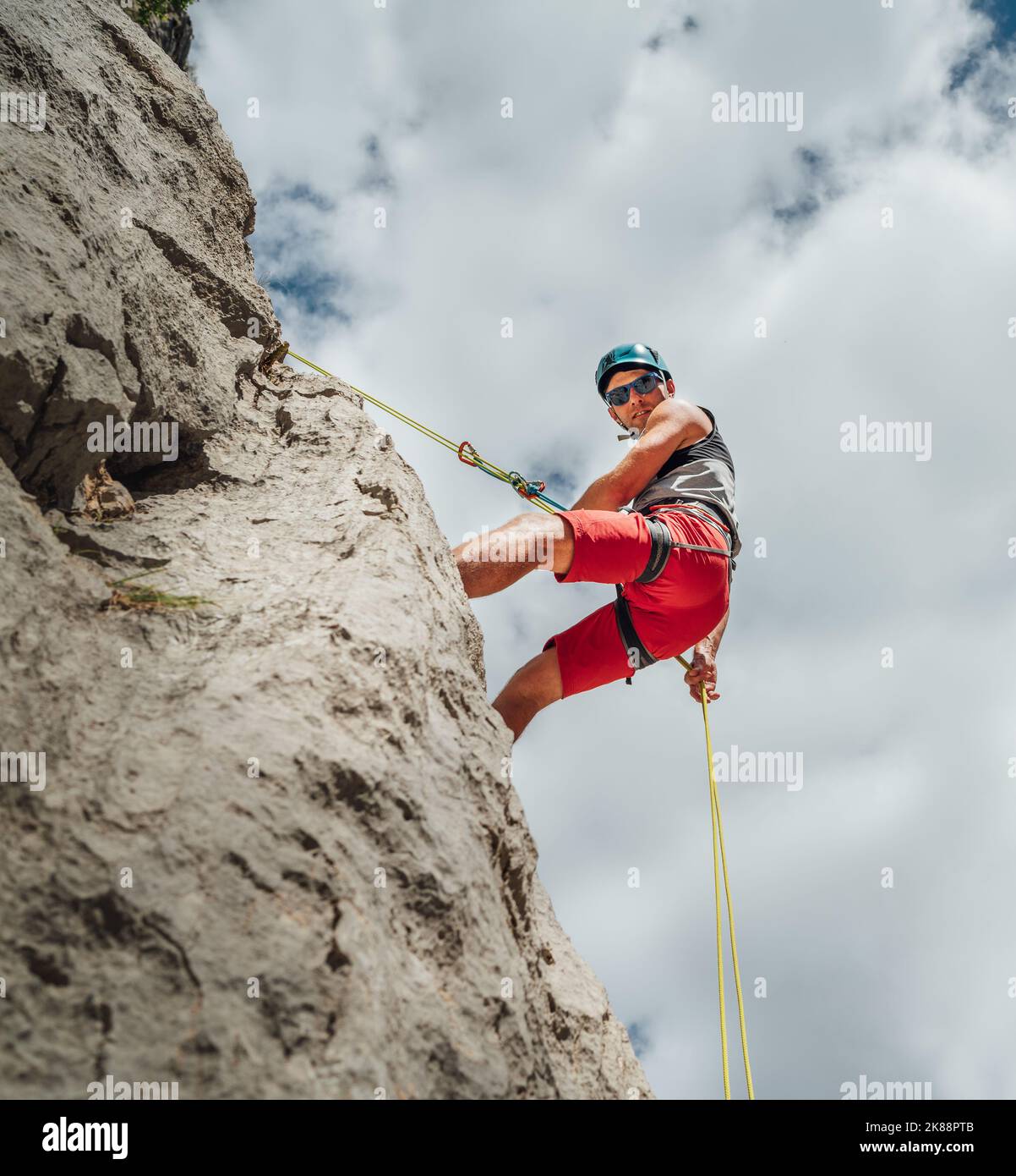 Man looking at rock wall hi-res stock photography and images - Alamy