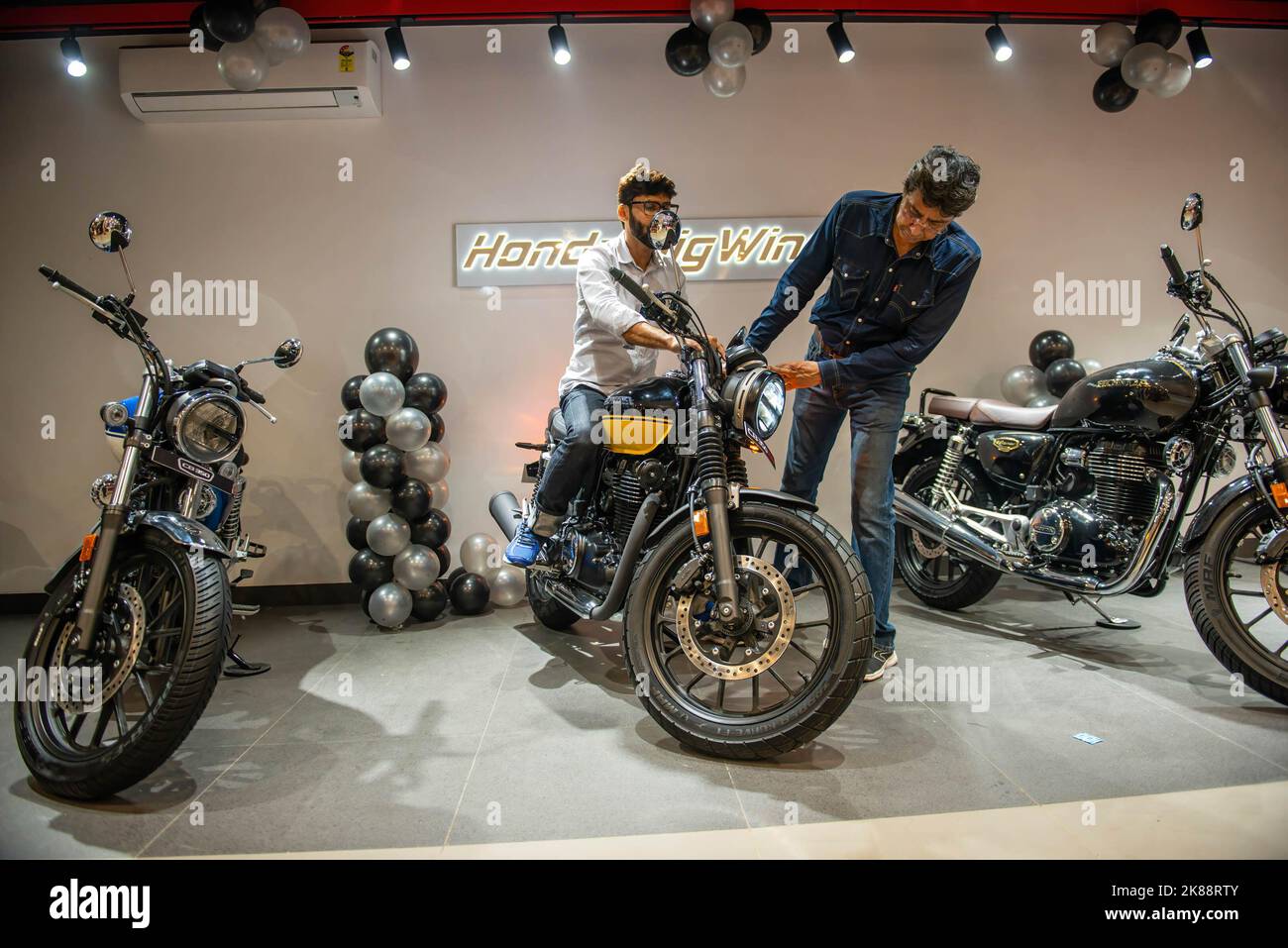 A customer checks out Honda CB 350 RS at a Honda BigWing showroom ...