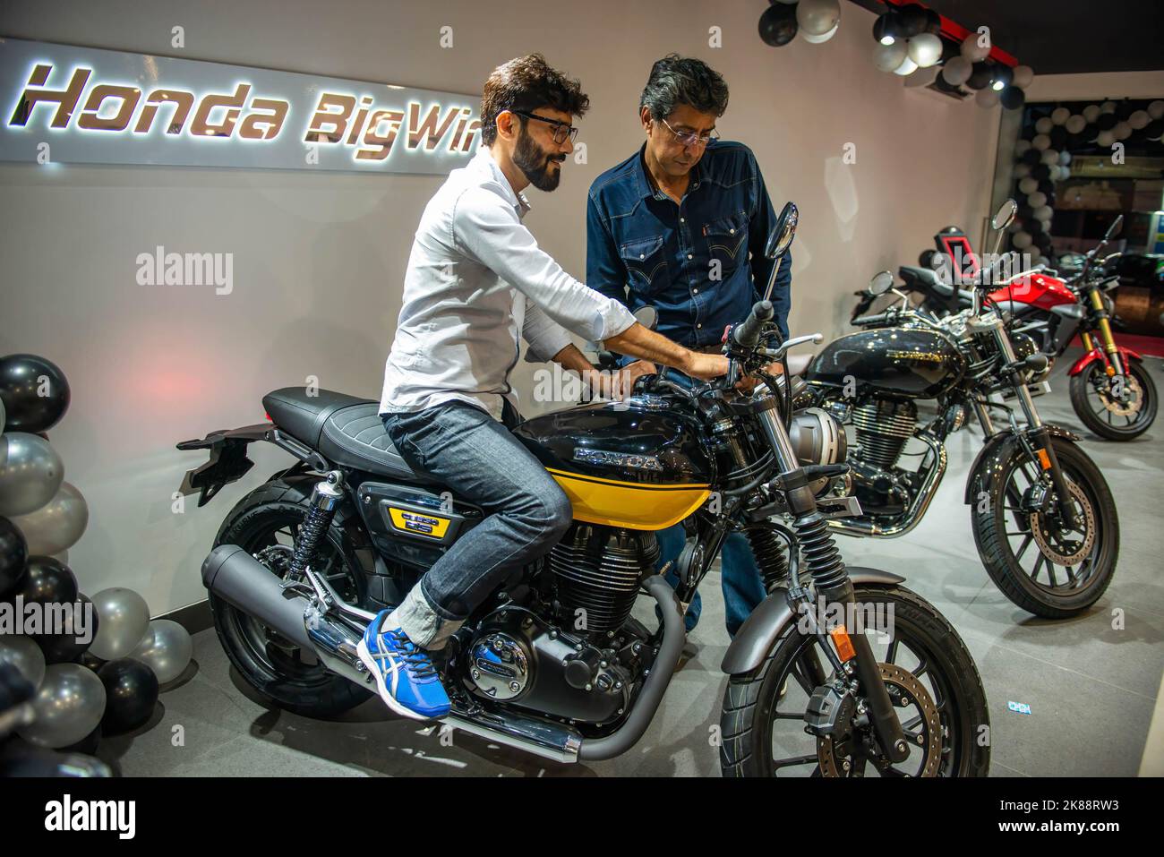 A customer checks out Honda CB 350 RS at a Honda BigWing showroom ...