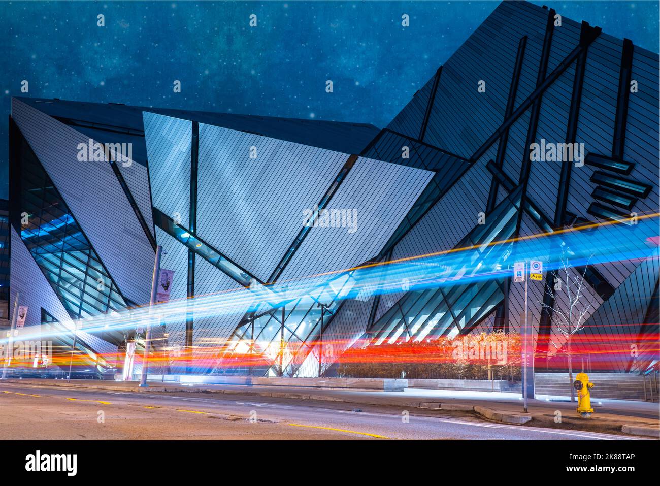 The Royal Museum in Toronto behind light trails at night under the ...