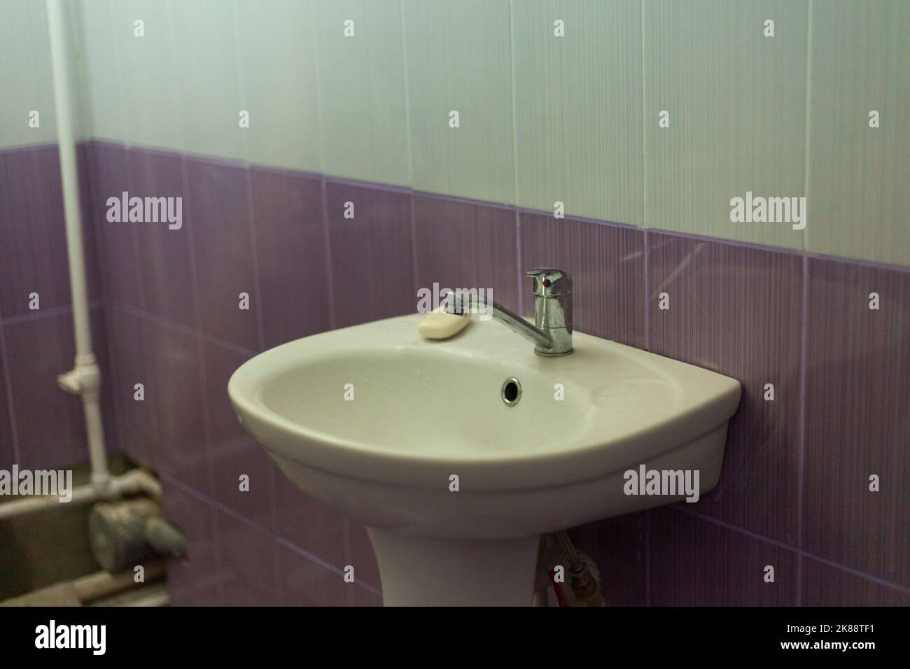 Sink in bathroom. Hand washbasin. Restroom in house. White plumbing in ...