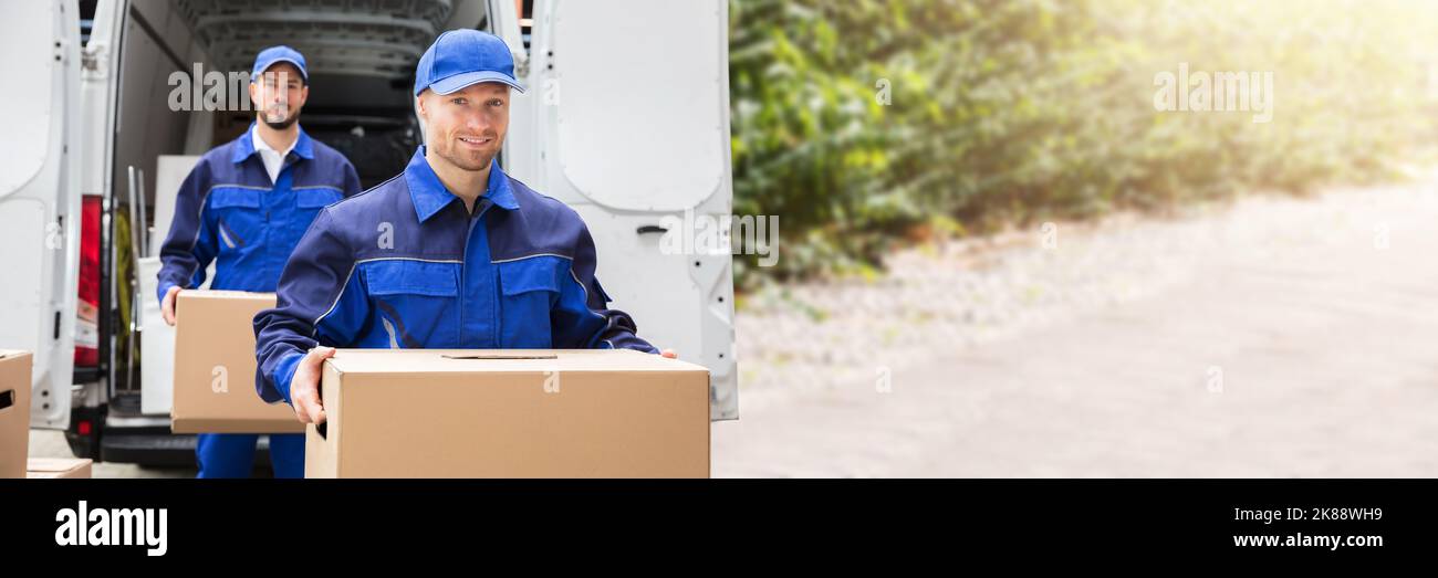Blue Truck Delivery Team. Movers Unloading Boxes Stock Photo - Alamy