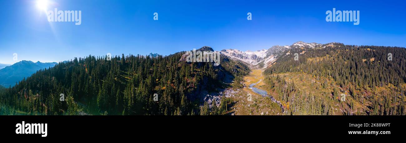 Aerial Panoramic View of River with green trees in Canadian Mountain ...