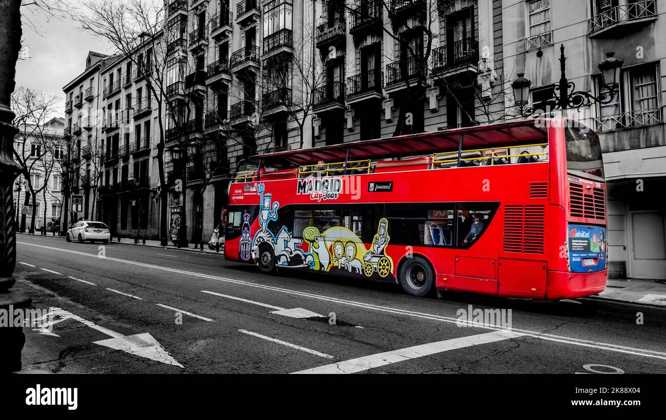 A color splash of a red Madrid bus in black and white city Stock Photo ...