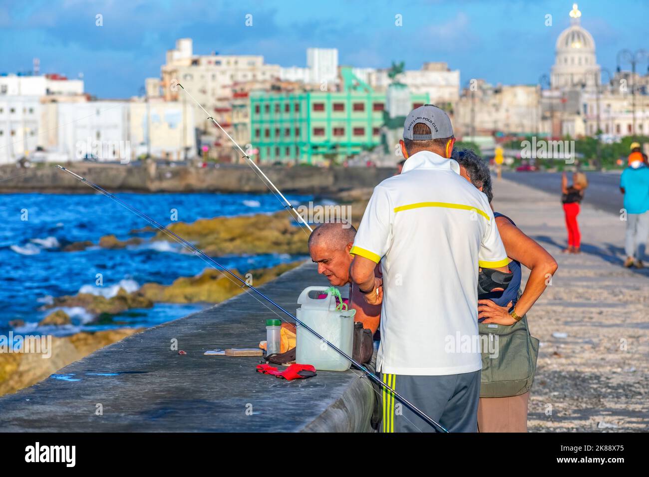 Cuban men fishing in El Malecon during the afternoon, Havana, Cuba ...