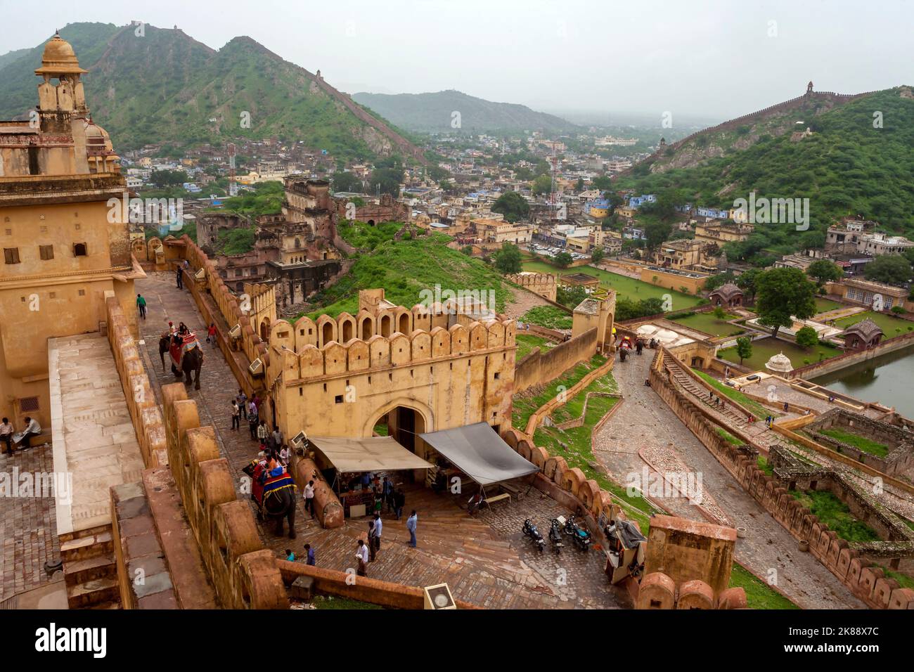 A breathtaking view of the Amber palace in India with green mountains ...