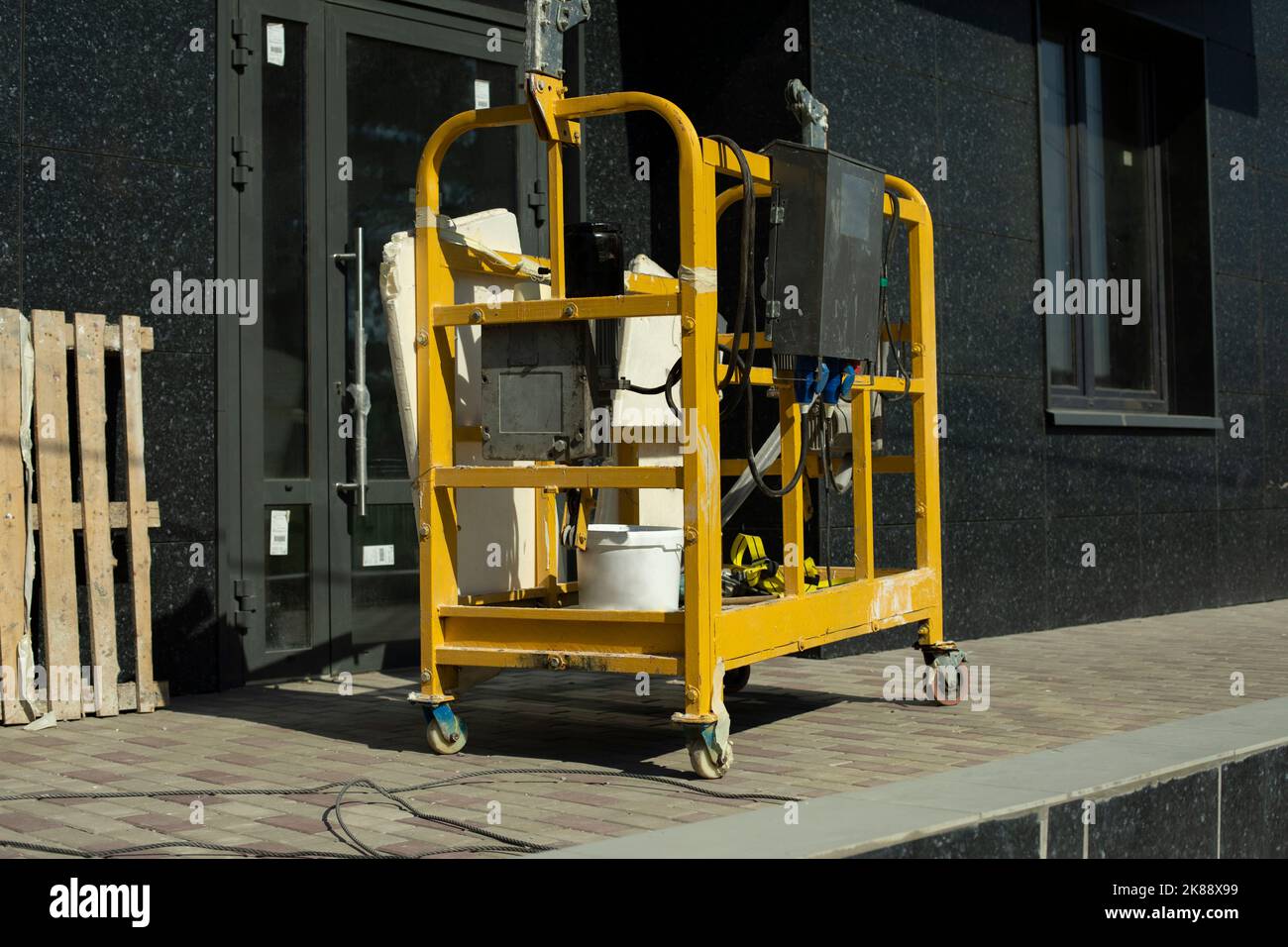 Yellow construction platform on construction site. Special elevator for ...