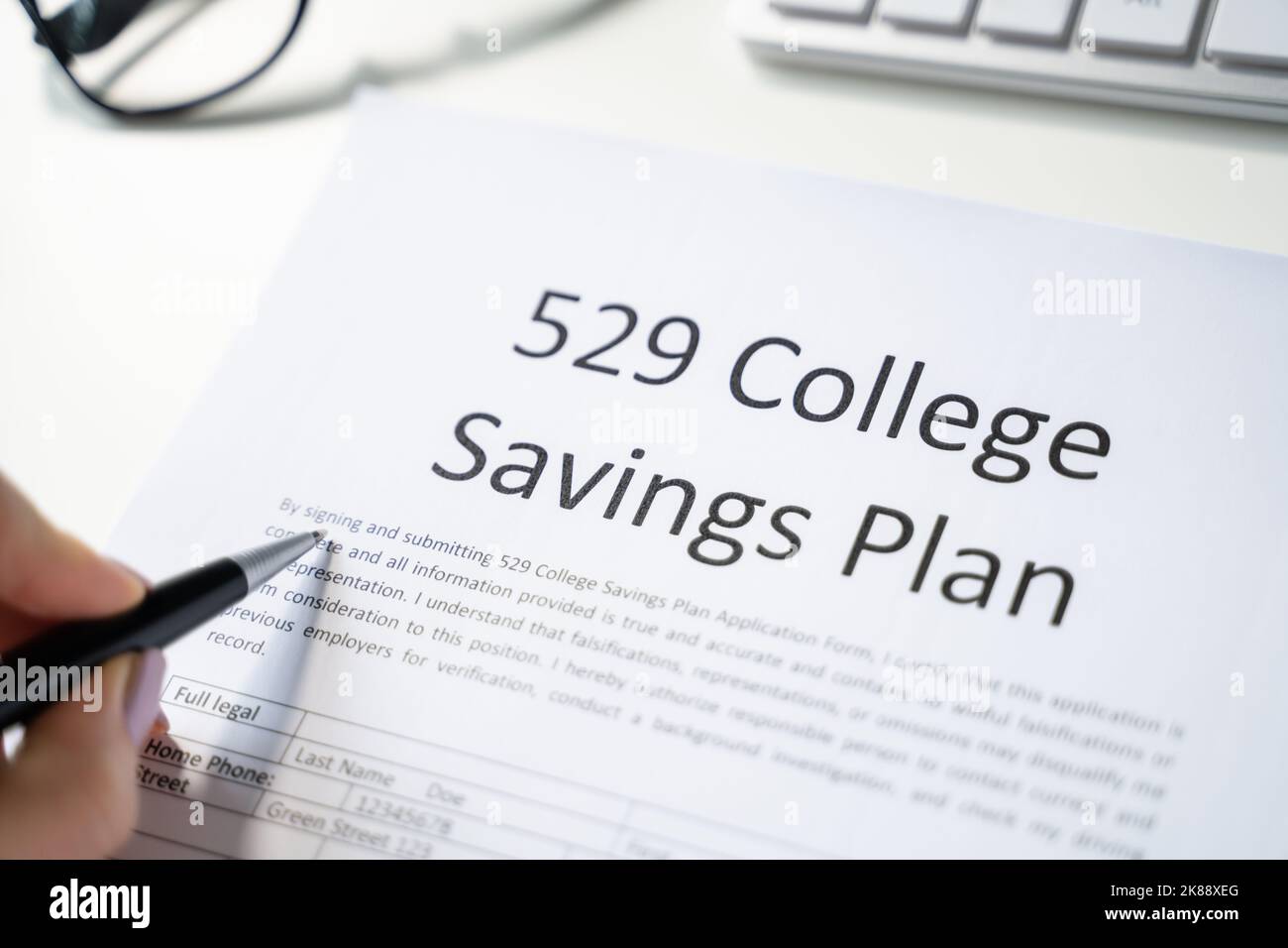 529 College Savings Plan Form With Small Graduation Hat, Spectacles And ...