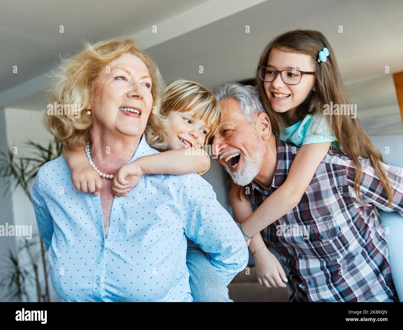 grandchild family child grandparent man woman grandfather happy together grandmother girl senior ...