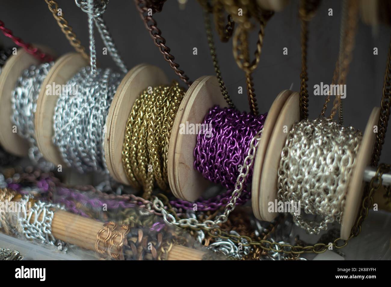 Chain decoration on coils. Sale of jewelry. Chains wound on reels ...