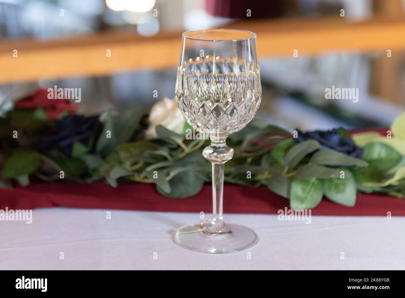 Bringing out the fine crystal wine glass for the party Stock Photo - Alamy