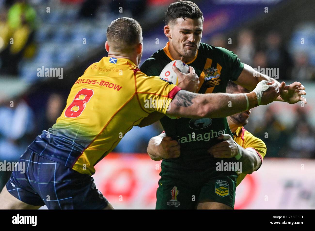 Coventry, UK. 21st Oct, 2022. Nathan Cleary of Australia is tackled by ...