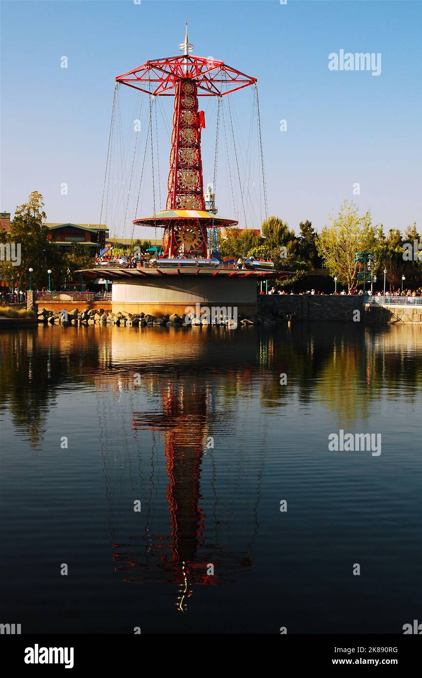 The Golden Zephyr ride in Disney's California Adventure is reflected in ...