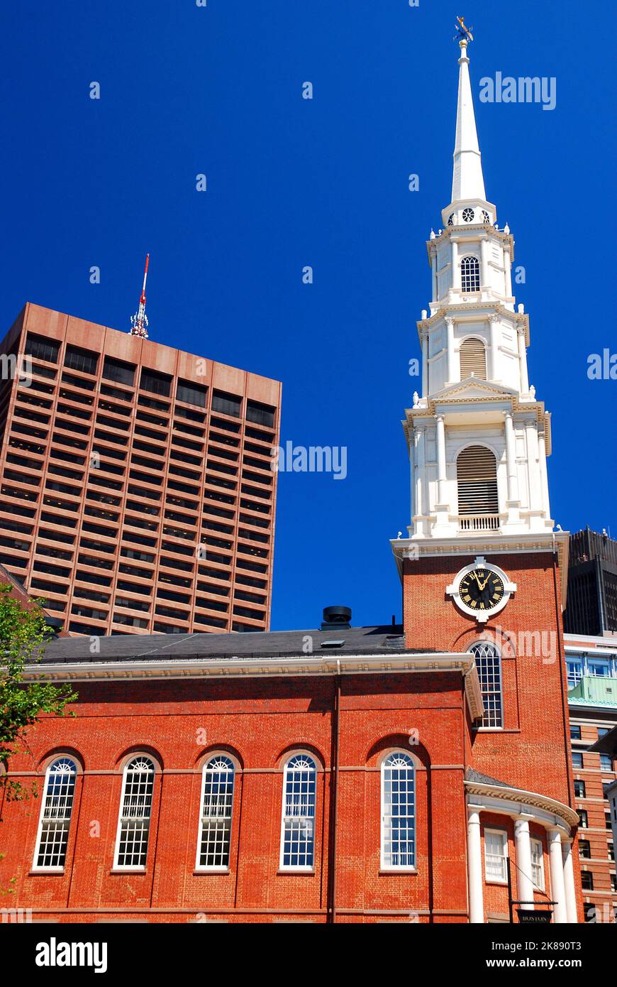 The spire of the Park Street Church, in Boston, rises with the ...