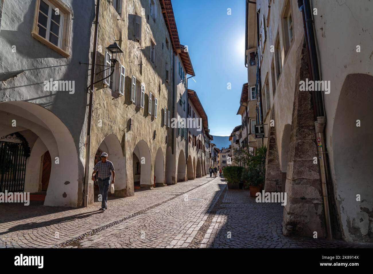The town of Neumarkt, in the Adige Valley, in South Tyrol, arcades in ...