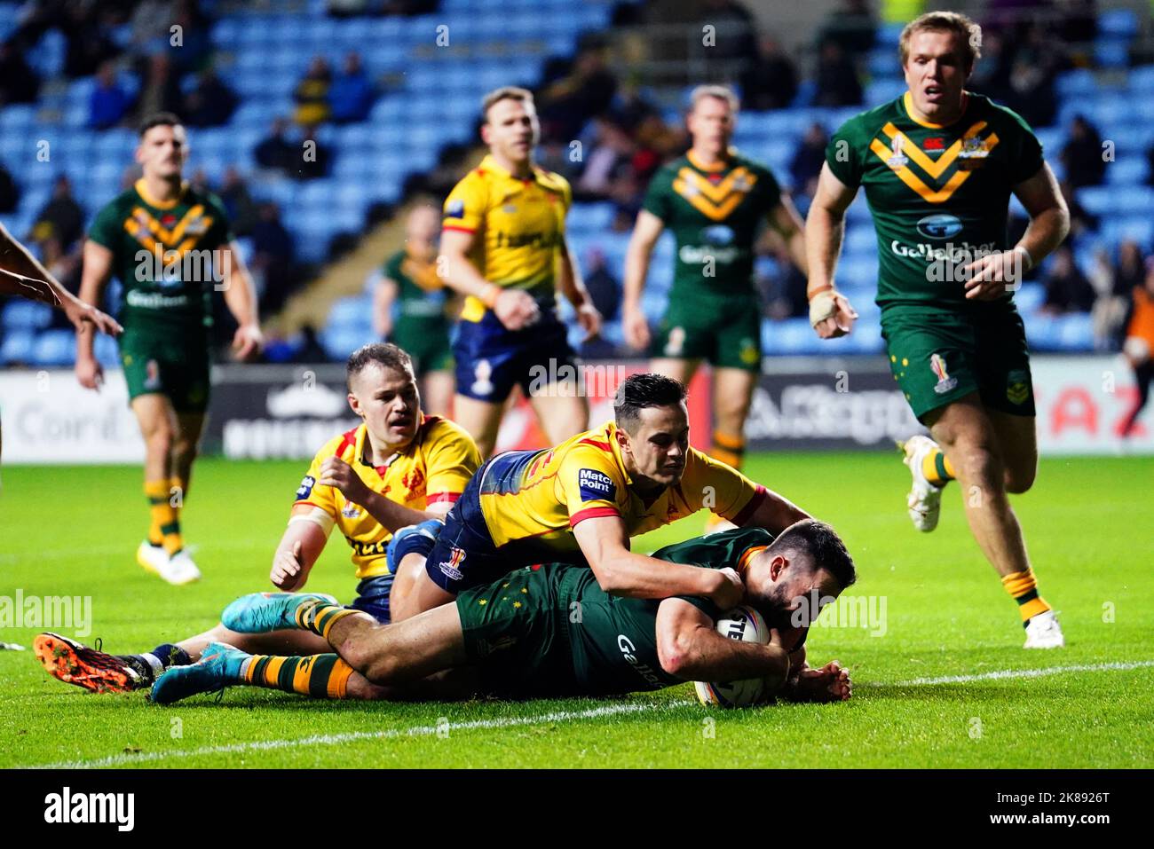 Australia's James Tedesco scores his side's eighth try of the game ...