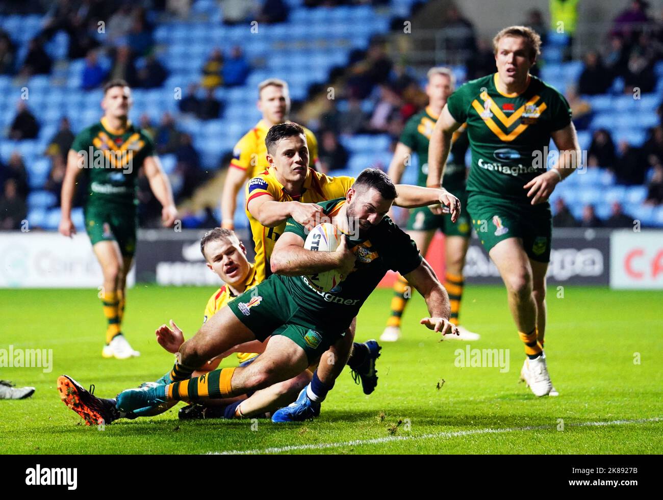 Australia's James Tedesco scores his side's eighth try of the game ...