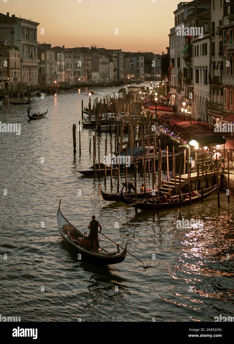 Traditional Venetian row boats gondolas on Grand Canal in Venice, Italy ...