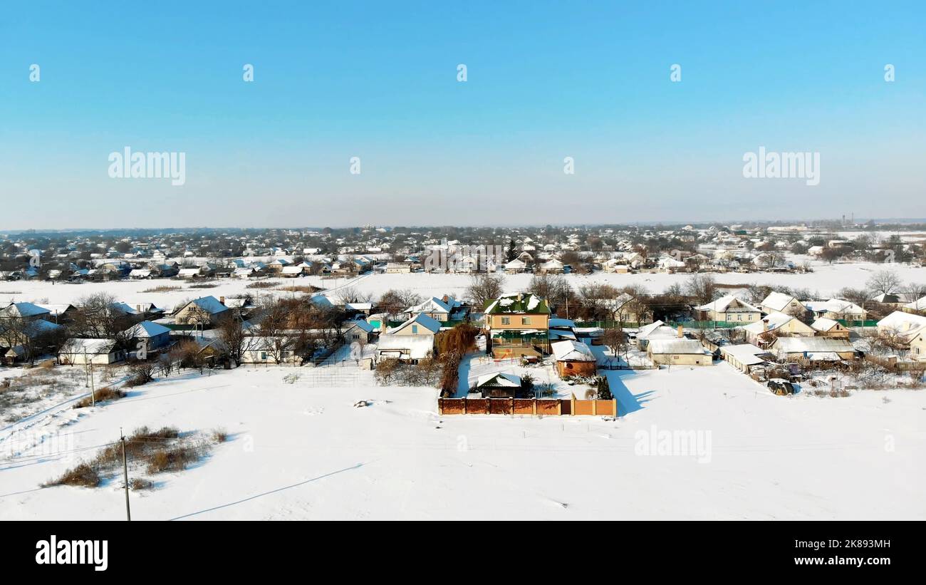 winter, snow-covered streets, houses. frosty sunny day. aero, view from ...