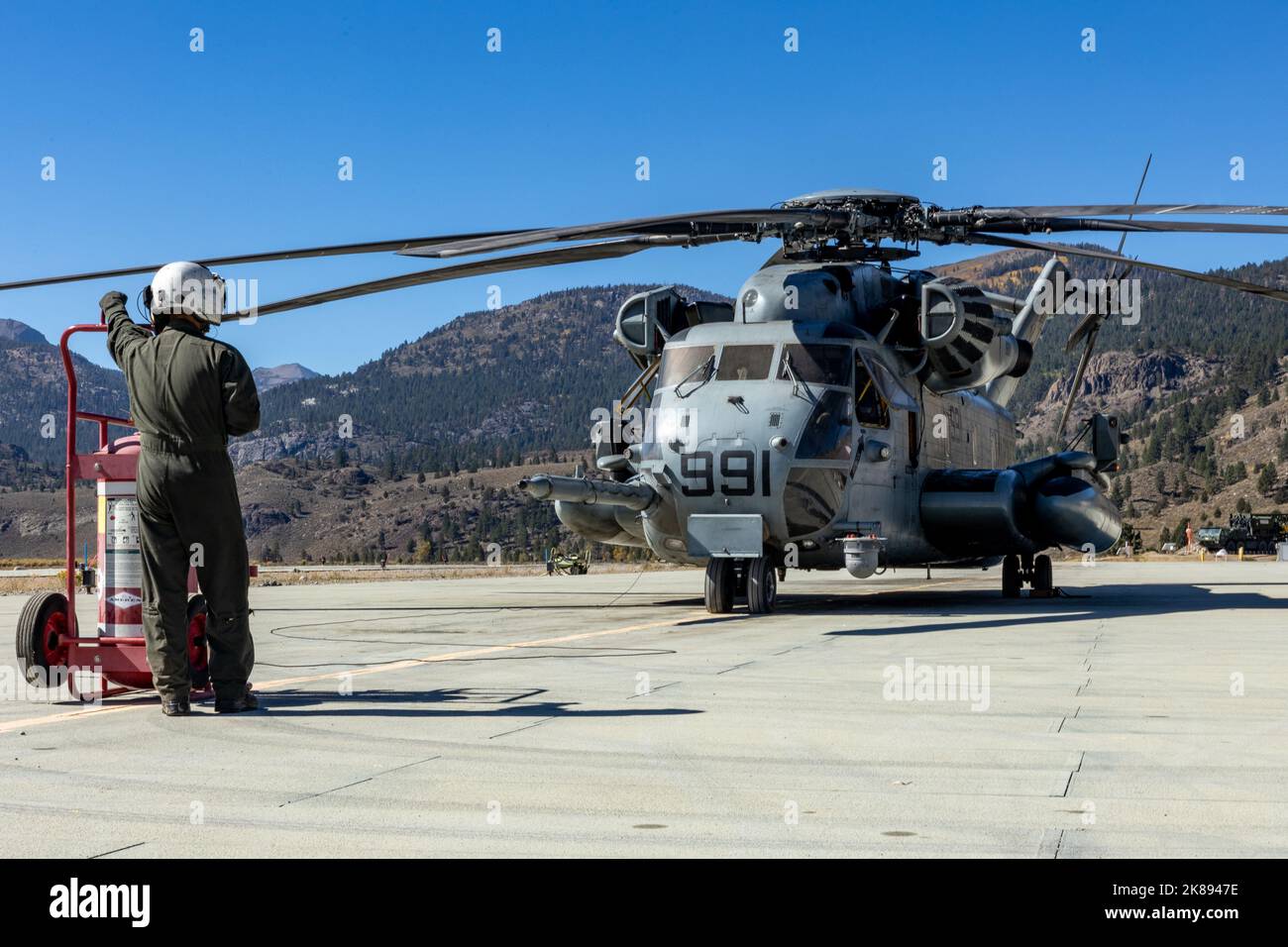 A U.S. Marine with Marine Heavy Helicopter Squadron (HMH) 462, Marine ...