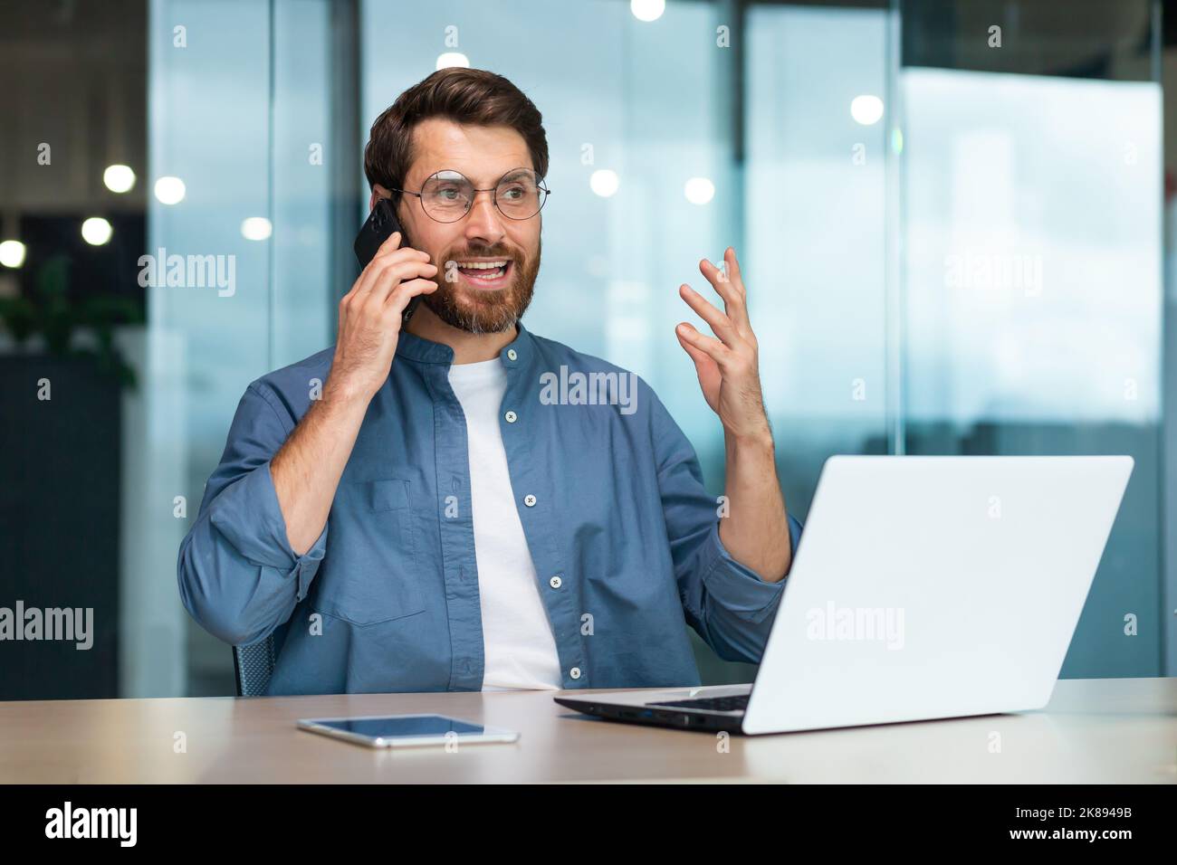 Successful freelancer working inside modern office building, man ...