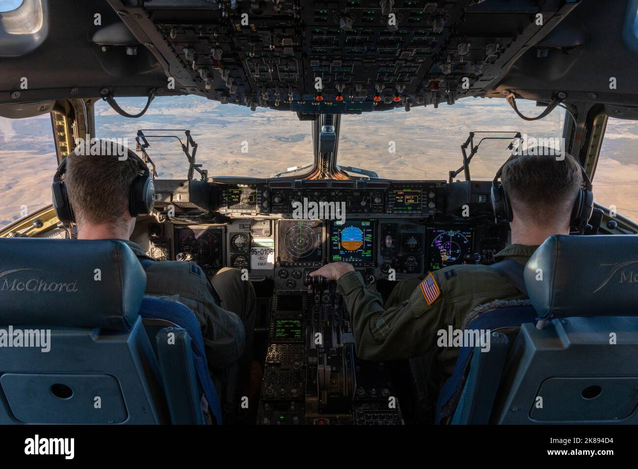 U.S. Air Force Capt. Ben Bessler, left, a pilot with the 4th Airlift ...