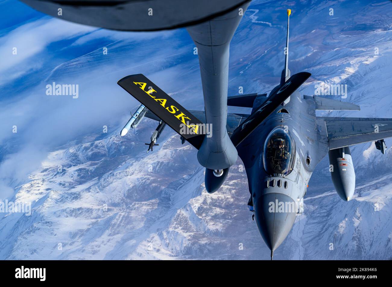 A U.S. Air Force F-16 Fighting Falcon moves into position to receive ...