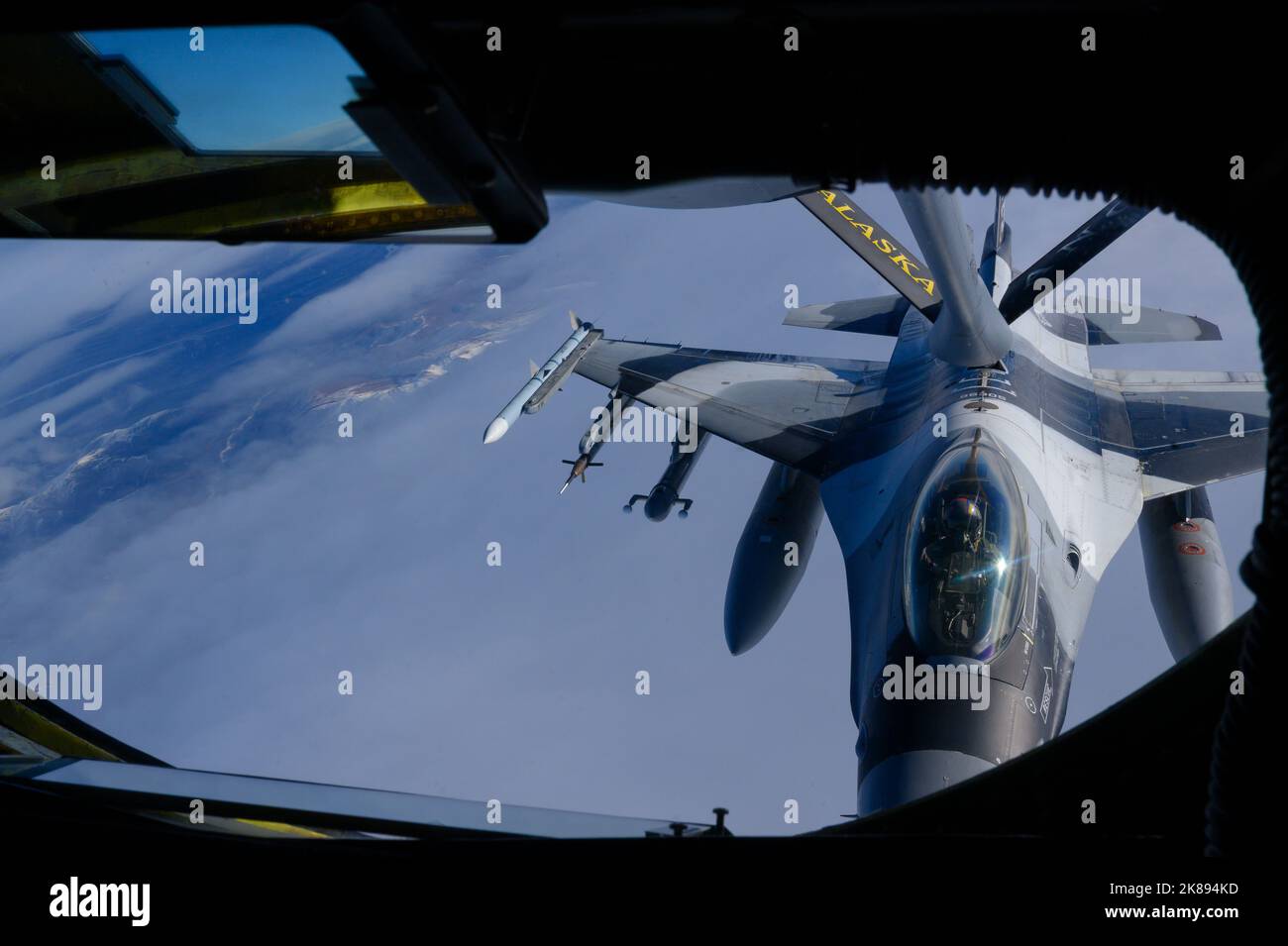A U.S. Air Force F-16 Fighting Falcon receives fuel from the 168th Air ...