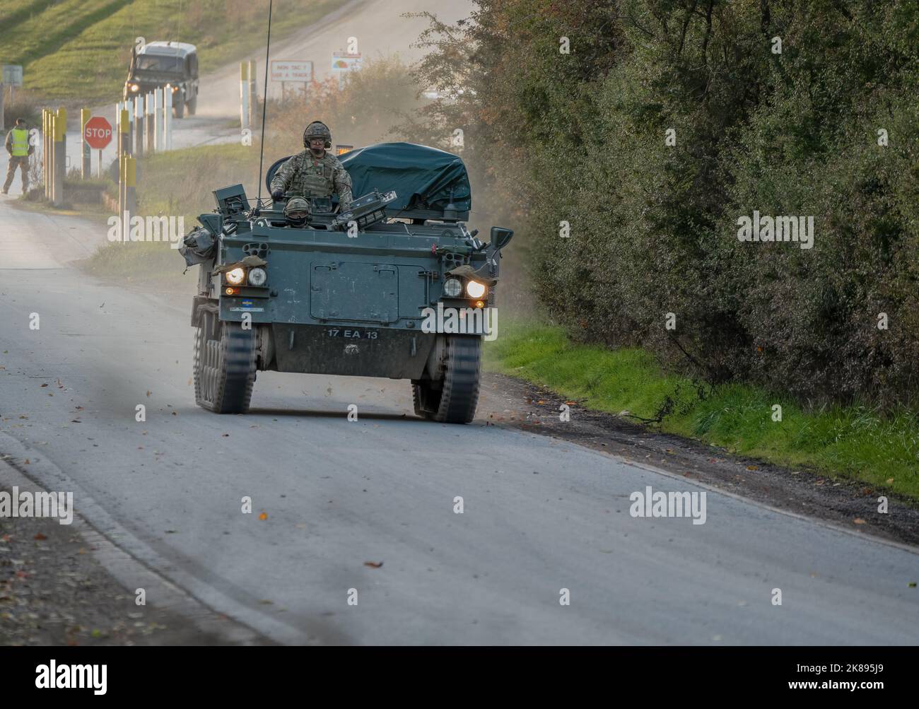 British army FV432 Bulldog APC hurtles down a country lane on a ...