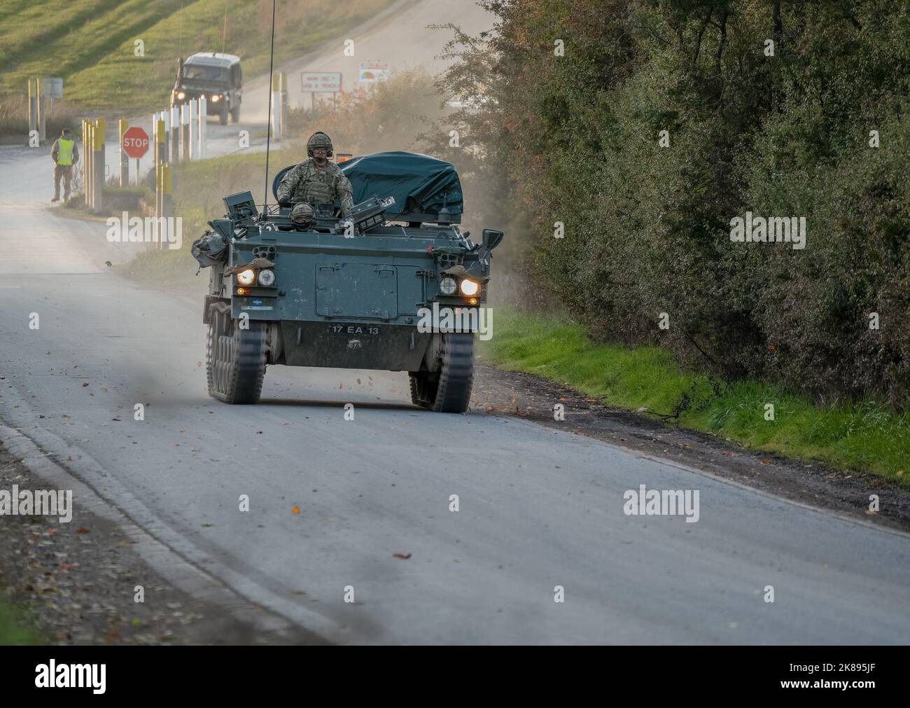 British army FV432 Bulldog APC hurtles down a country lane on a ...