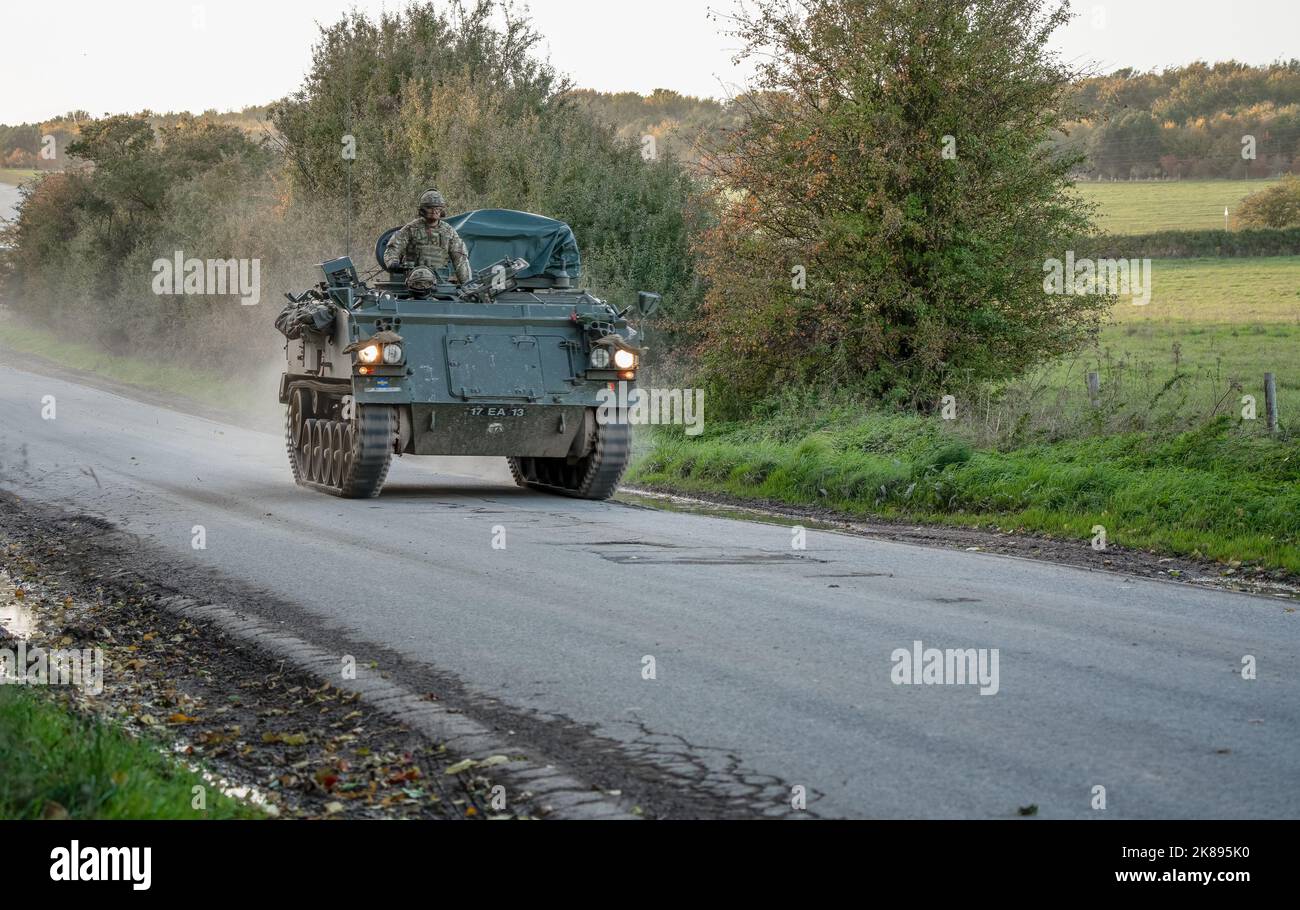 British army FV432 Bulldog APC hurtles down a country lane on a ...