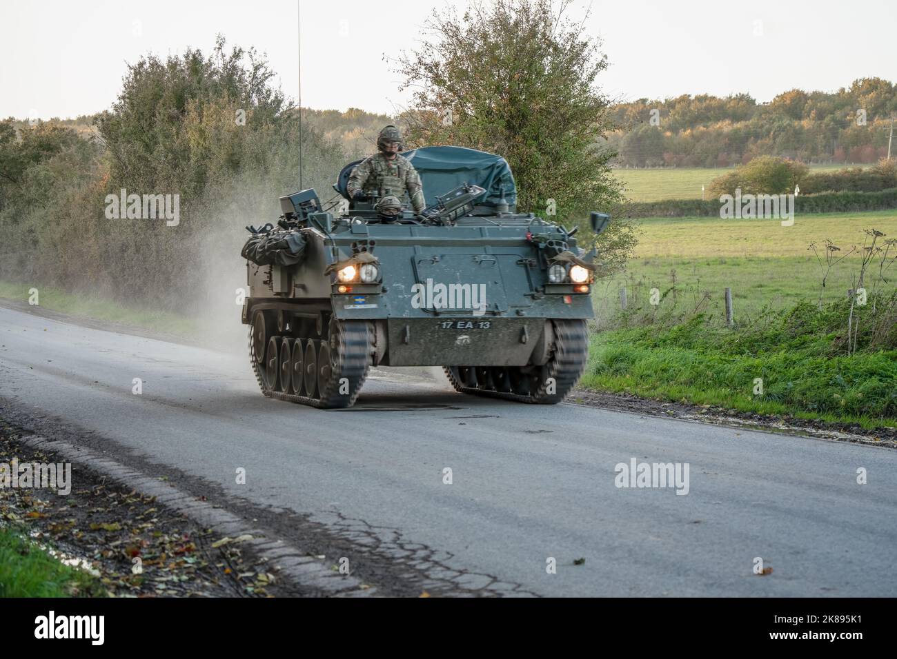 British army FV432 Bulldog APC hurtles down a country lane on a ...