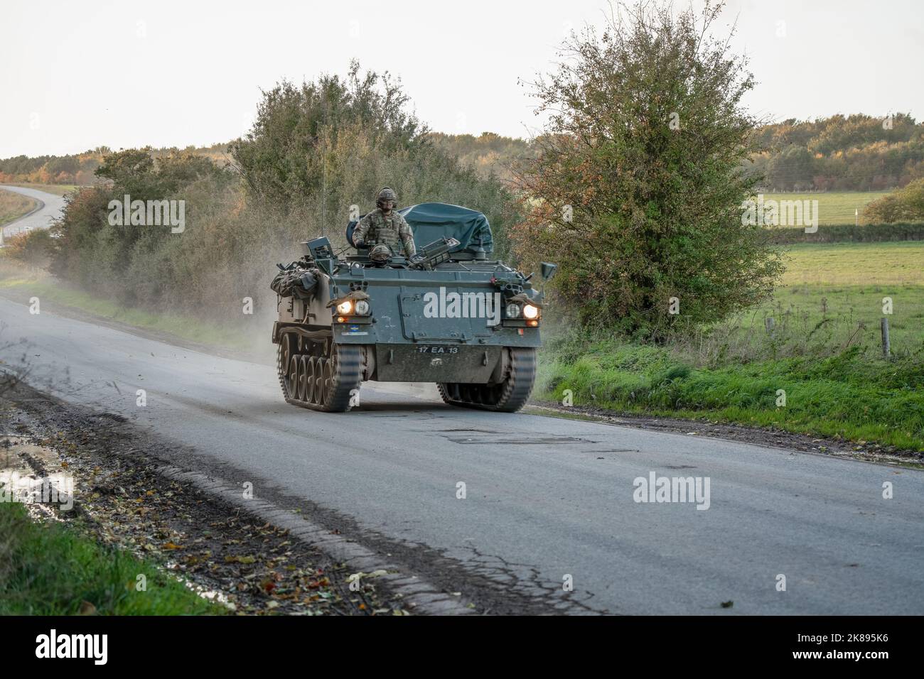 British army FV432 Bulldog APC hurtles down a country lane on a ...