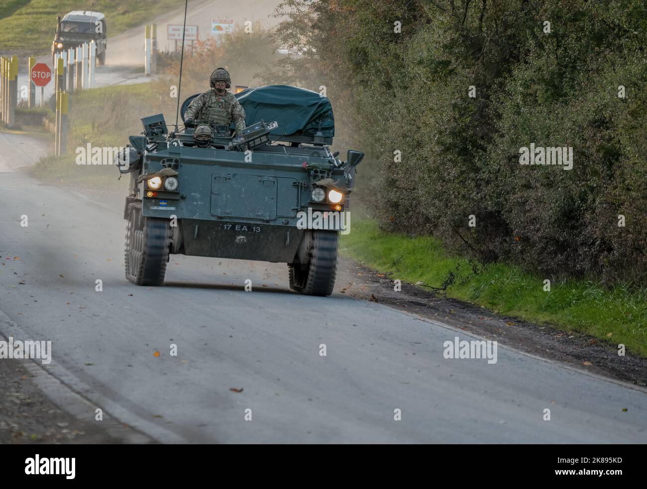 British army FV432 Bulldog APC hurtles down a country lane on a ...