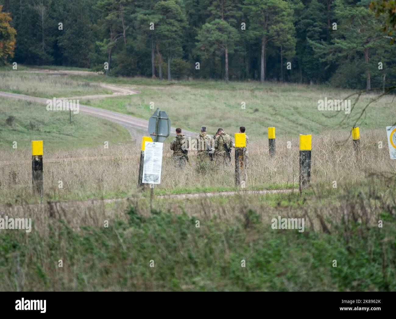 several British army soldiers equipped with telescopic sighted rifles ...