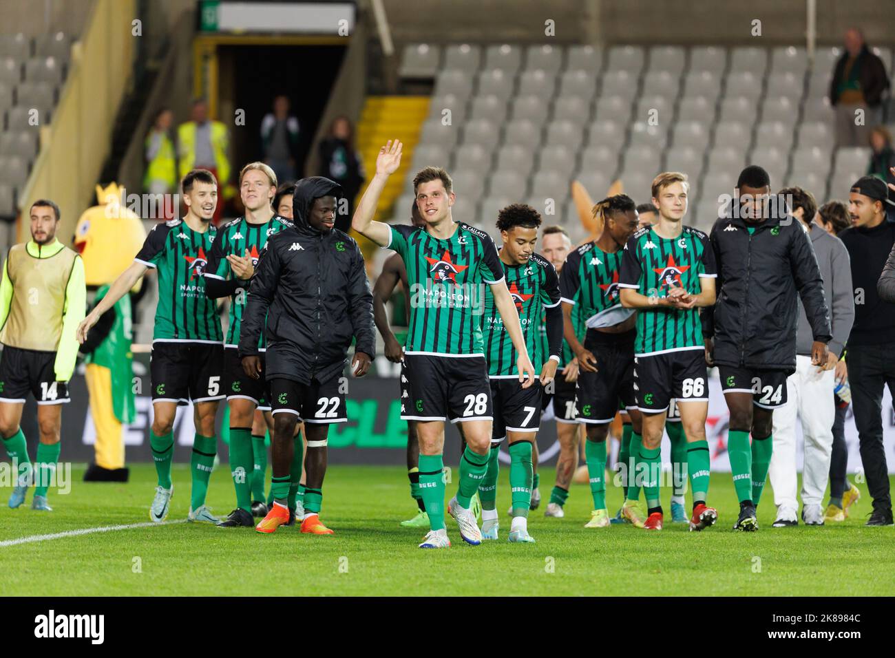 Cercle's players celebrate after winning a soccer match between Cercle ...
