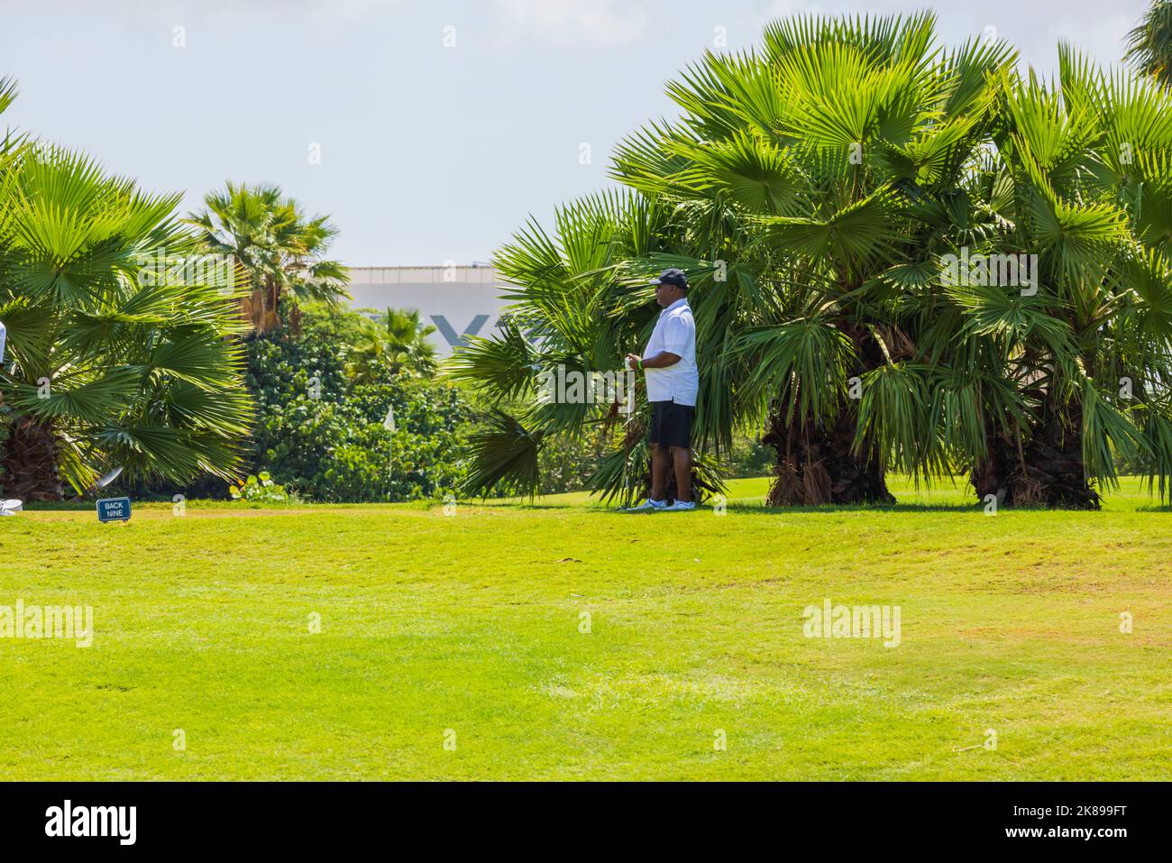 Beautiful view of golf course and man playing golf. Aruba. Oranjestad ...