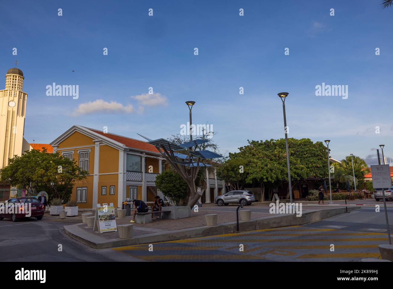 Beautiful architecture view in Oranjestad city center with parked cars ...
