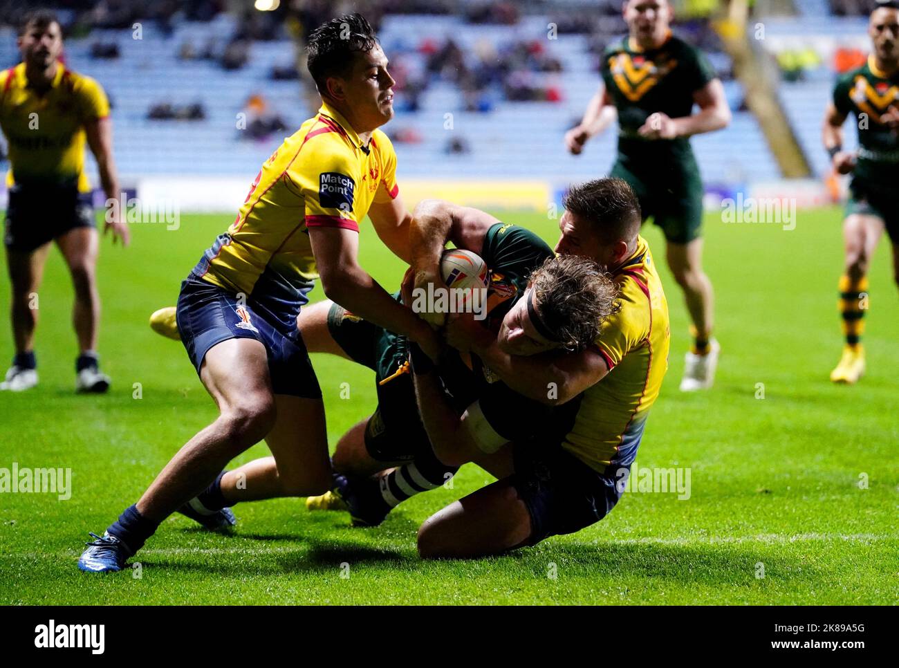 Australia's Campbell Graham (centre) is tackled by Scotland's Matty ...